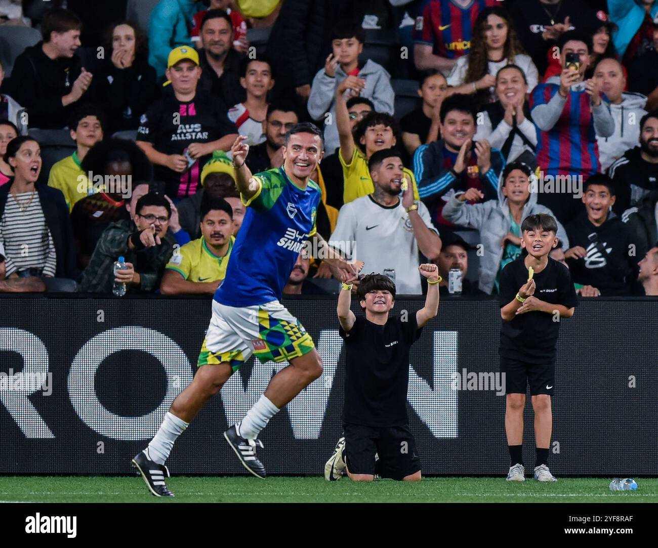 Tim Cahill of Cahill's XI celebrates after scoring a goal by heading ...