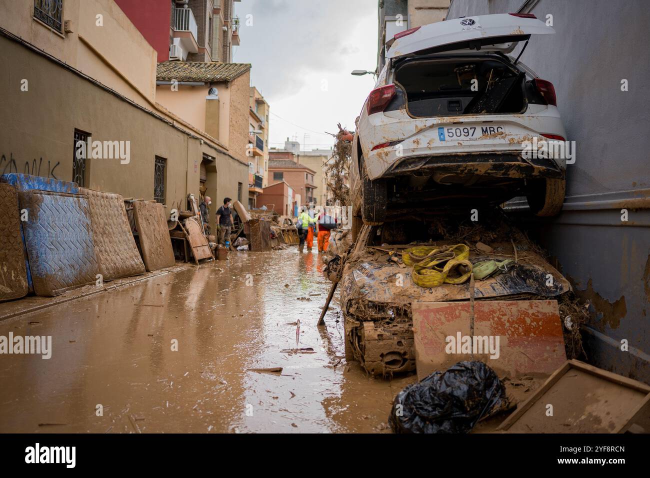 Destroyed cars and rubble are seen piled in the streets as a ...