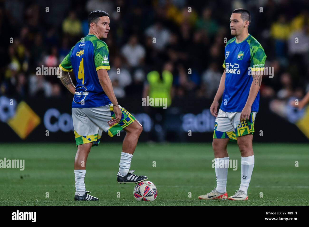 Tim Cahill and his son Kyah Cahill of Cahill's XI ready to kick-off and ...