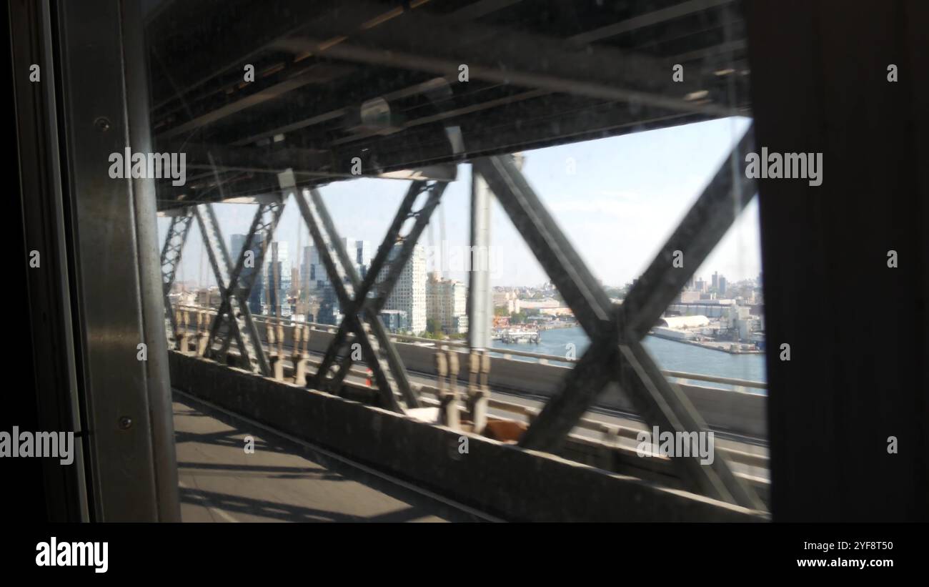 New York City subway train, Williamsburg bridge. Shaking camera thru dirty window. Manhattan ...