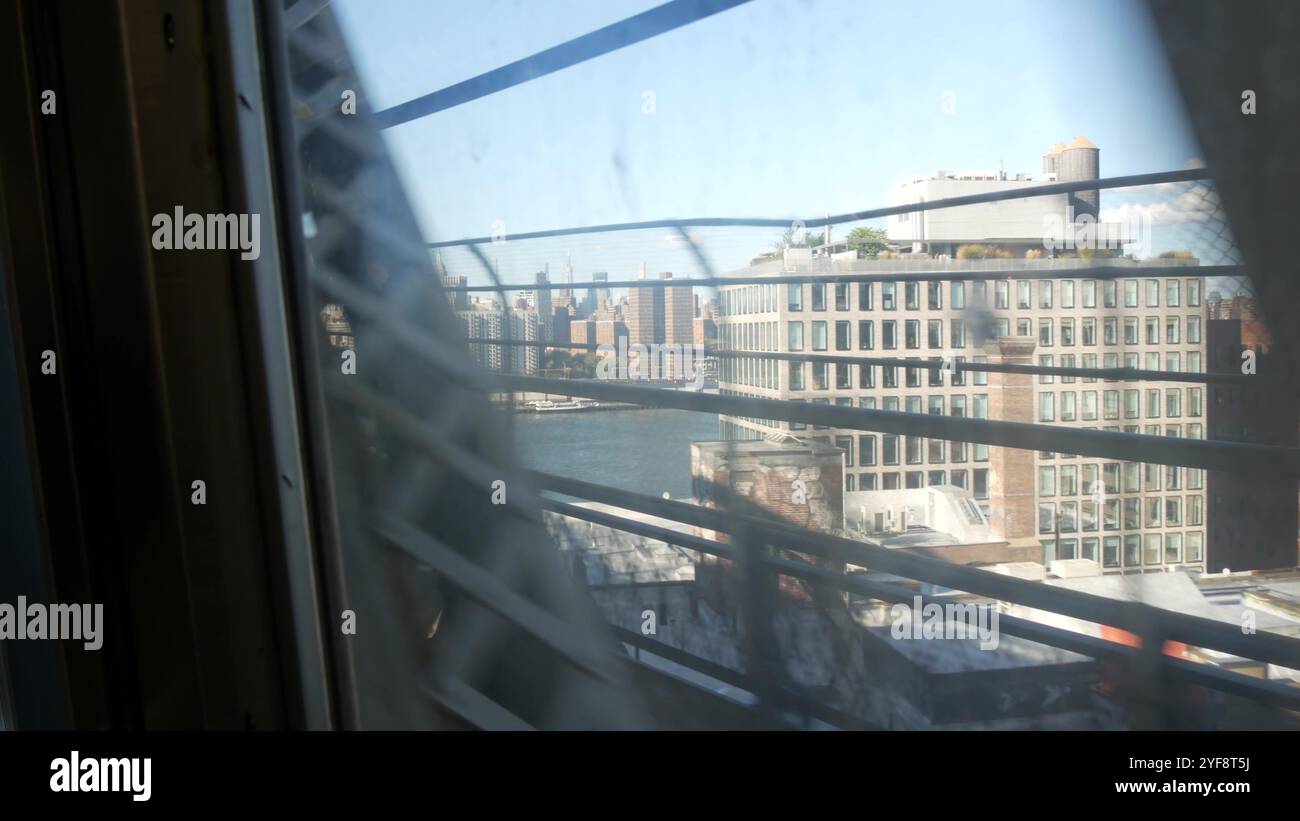 New York City subway train, Manhattan bridge. Shaking camera thru dirty ...