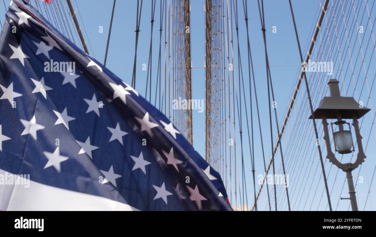 American flag on Brooklyn Bridge to Manhattan, New York City. Patriotic ...