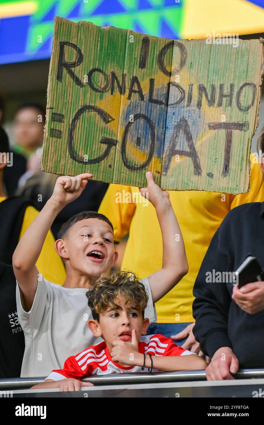 A fan holds a sign up ahead of kick-off during the Joga Bonito Tour ...