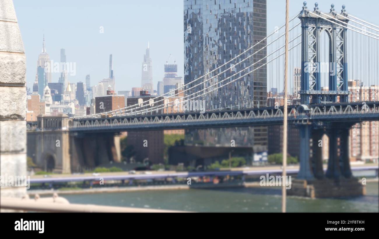 New York City Manhattan Bridge from Brooklyn Bridge view. Empire State ...