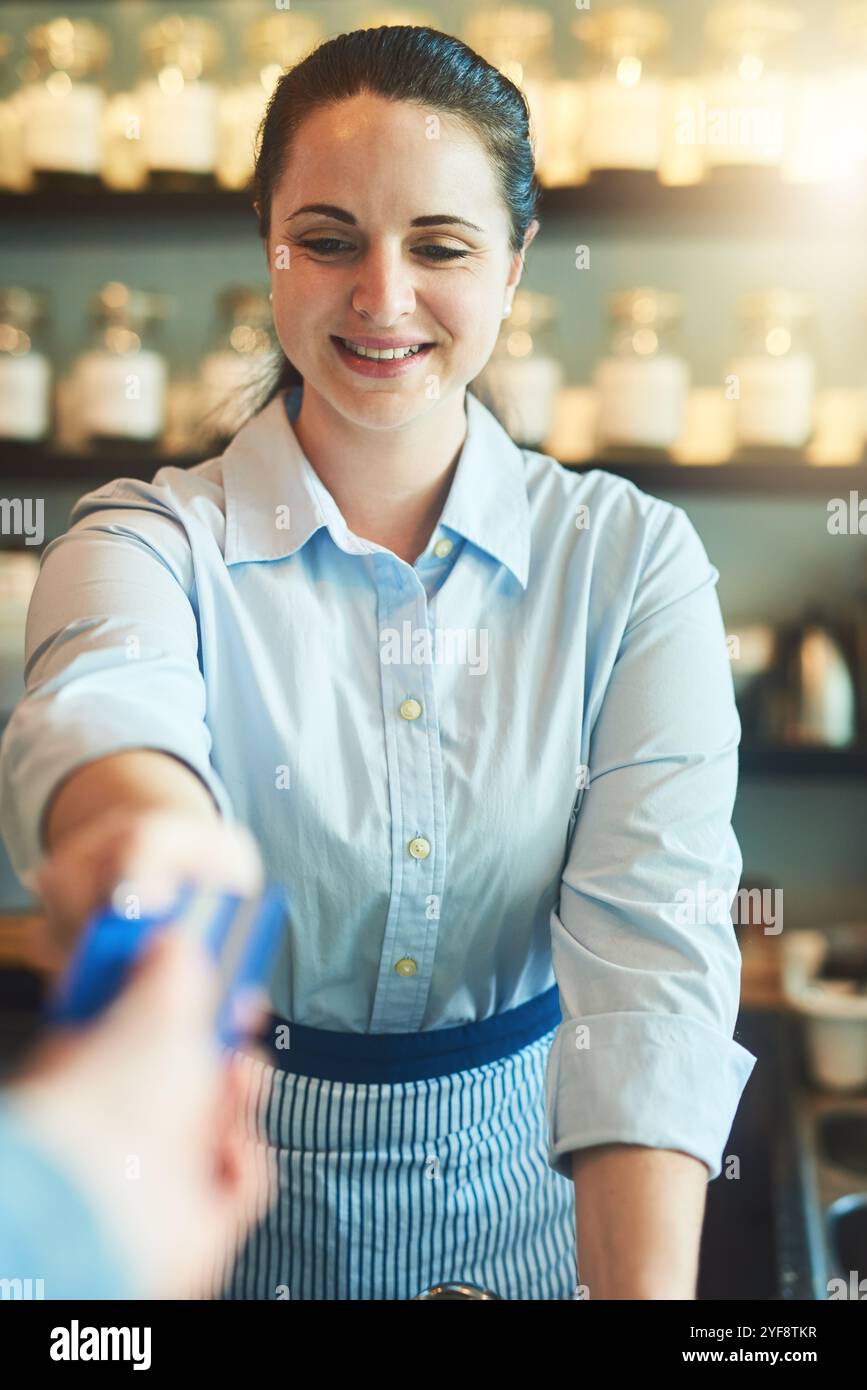 Woman, cashier and credit card to pay at shop, transaction and customer ...