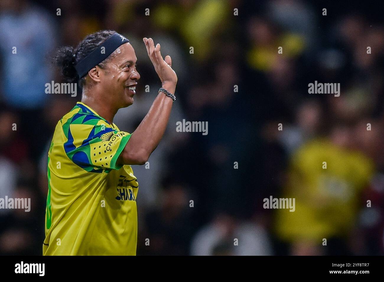 Ronaldinho of Ronaldinho's XI waves to fans during the Joga Bonito Tour ...