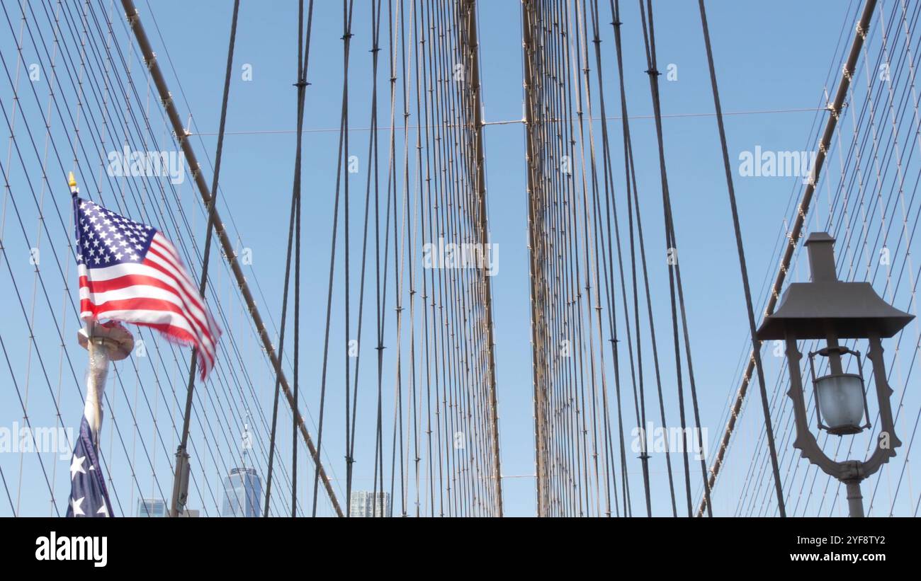 American flag on Brooklyn Bridge to Manhattan, New York City. Patriotic ...