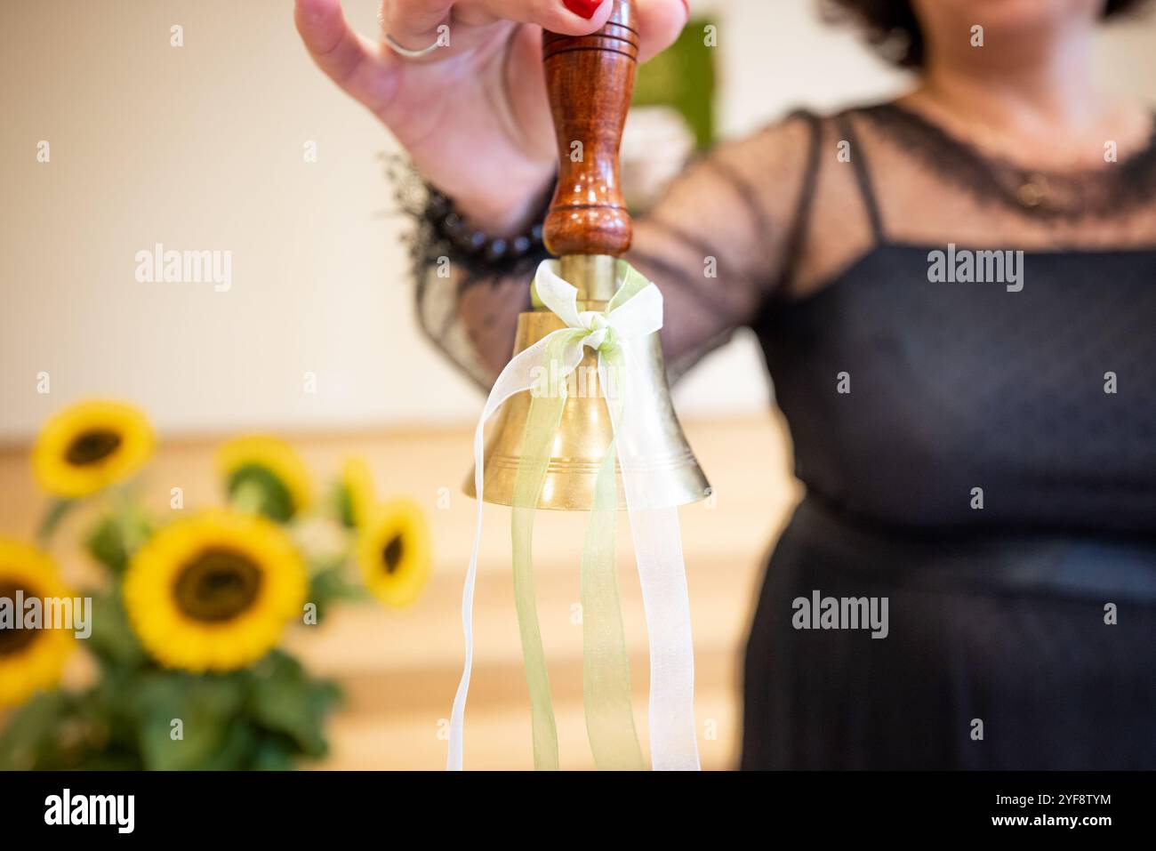 Female school principal holds the school bell on September 1 Stock ...