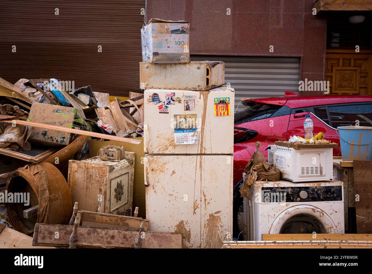 Paiporta, Spain. 03rd Nov, 2024. Cars and rubble are seen piled in the ...