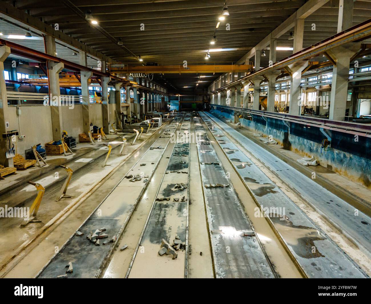 The interior of a big industrial building or factory with steel and ...