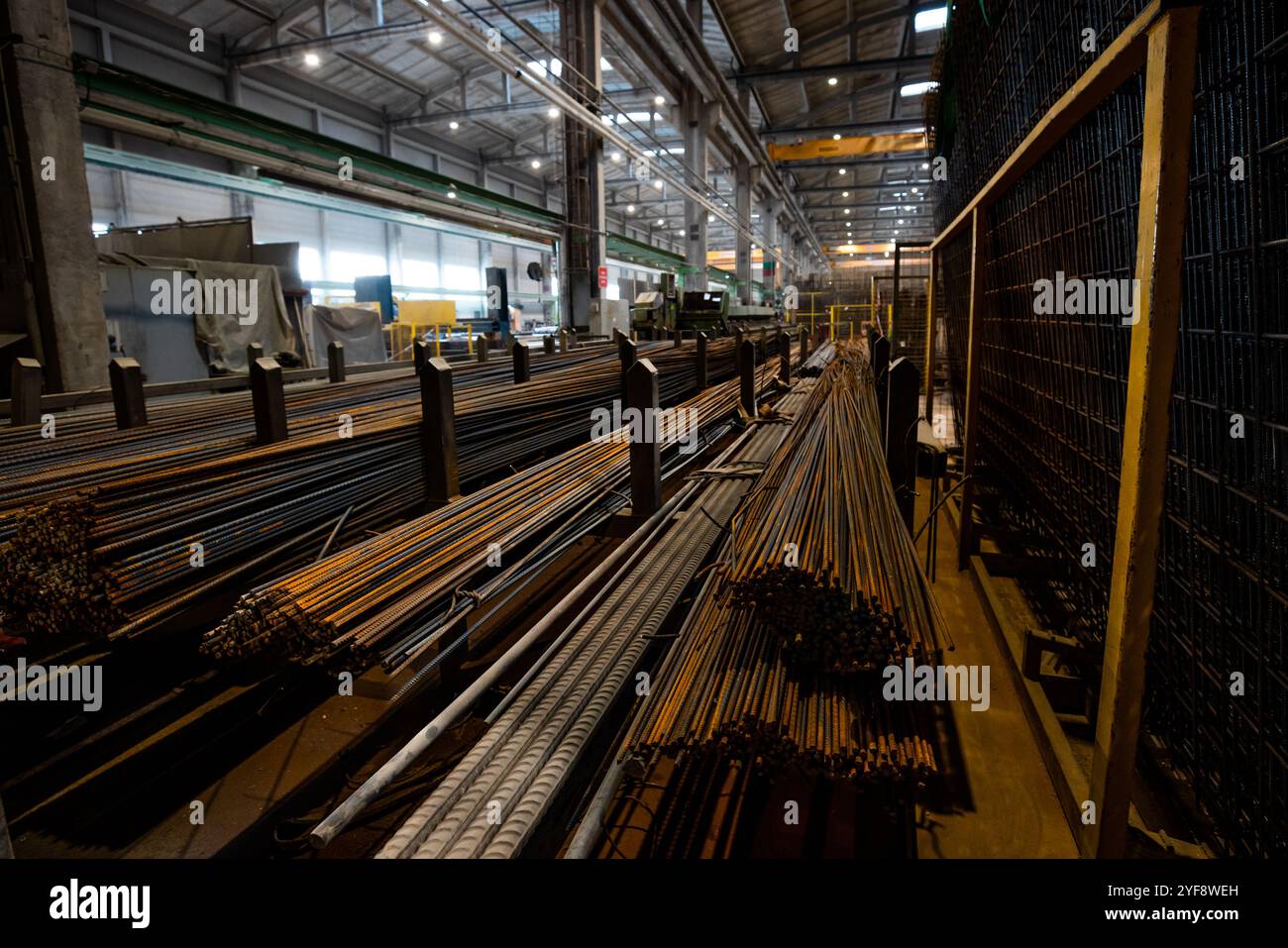 Steel rods or bars used to reinforce concrete, in warehouse at the ...
