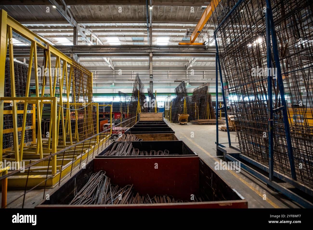 The interior of a big industrial building or factory with steel and ...