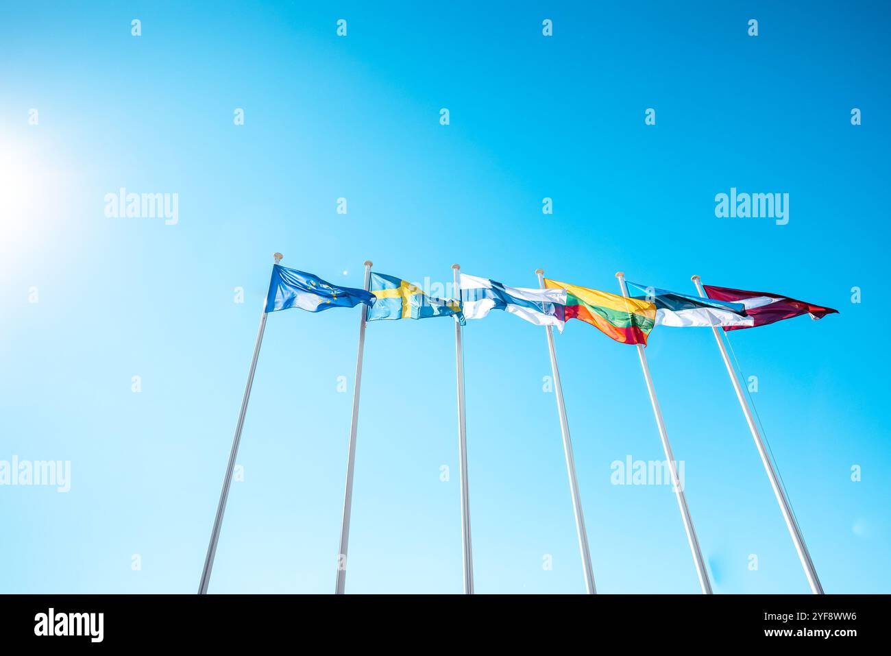 The flags of the Baltic countries and Scandinavia waving in the sky of ...