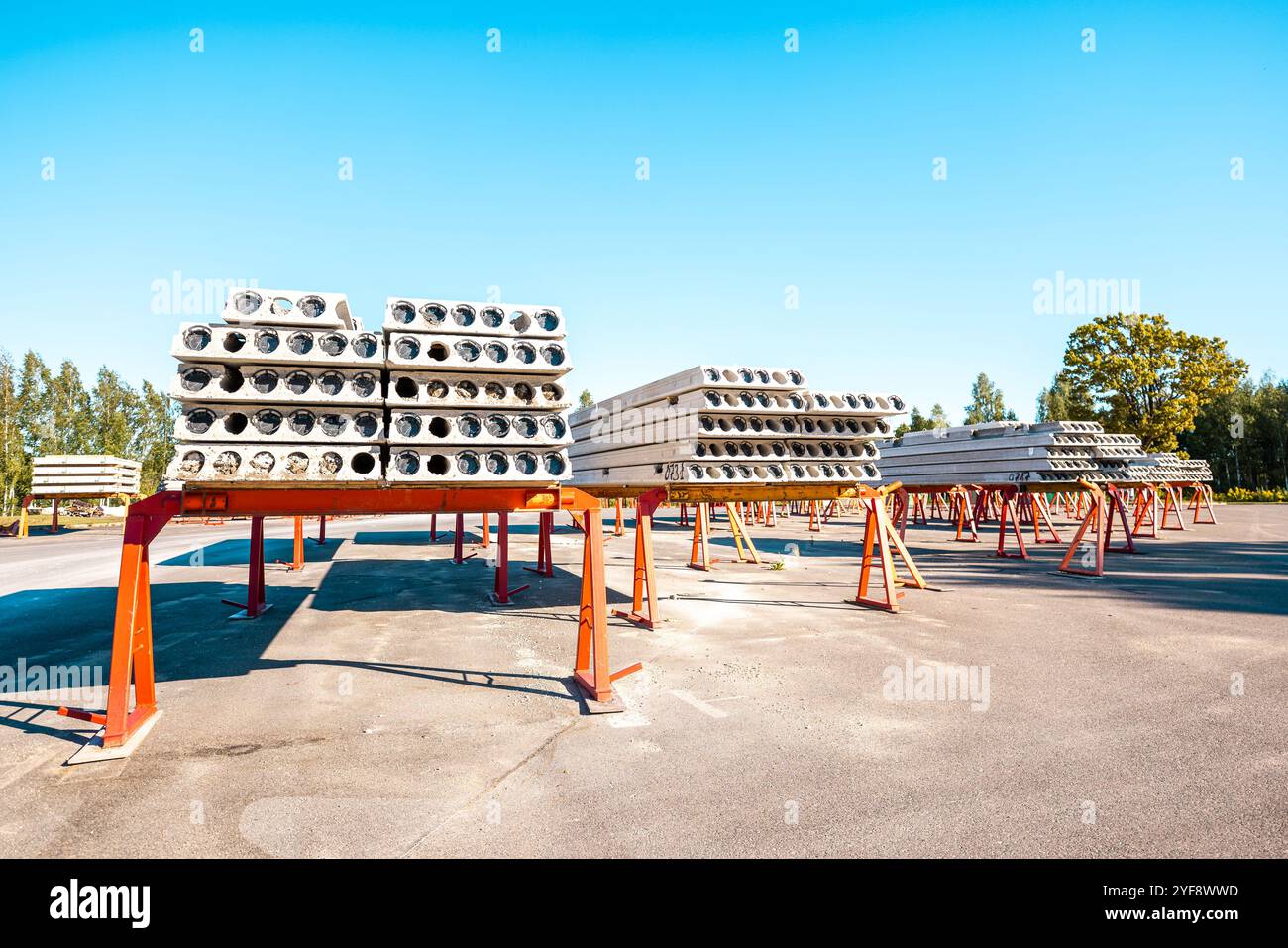 Stack of precast reinforced concrete slabs in a house-building factory ...