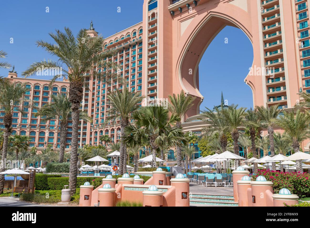 Palm trees and gardens around the pool garden area at the Atlantis the ...