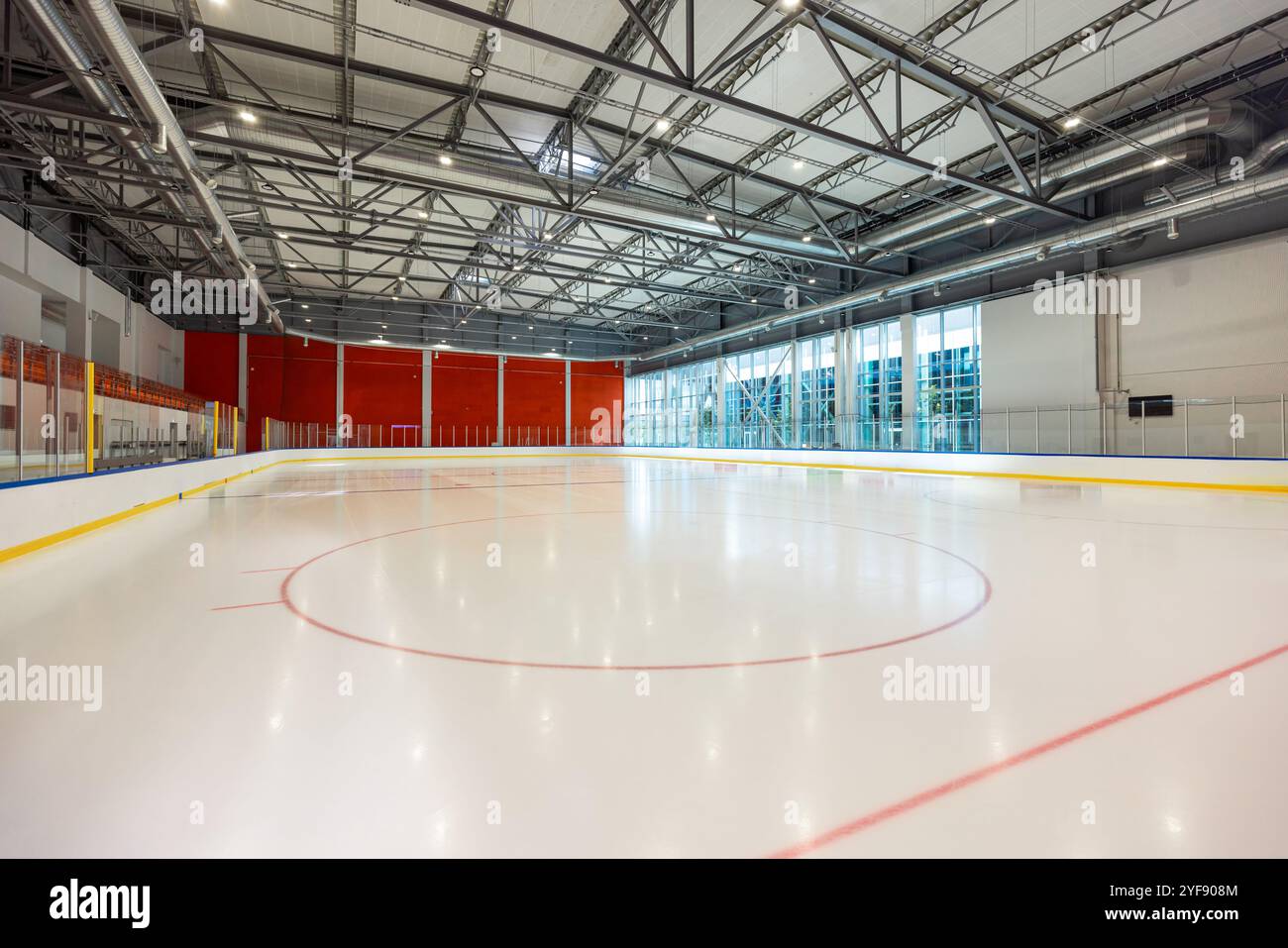 Sleek Ice Rink in a Modern Facility Featuring Expansive Glass Walls and ...