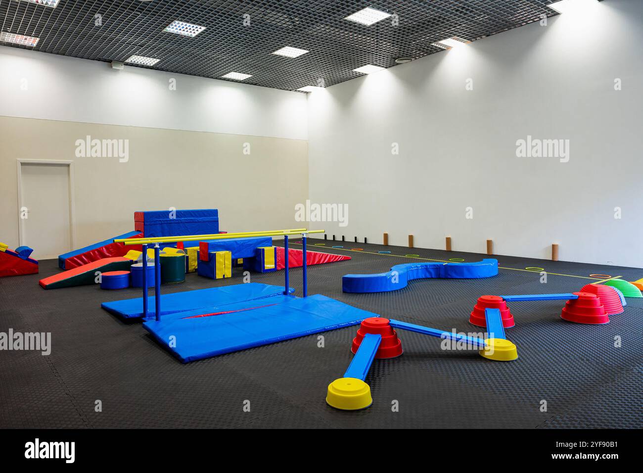 Colorful Gymnastic Equipment in Modern Training Room Kid's Physical ...