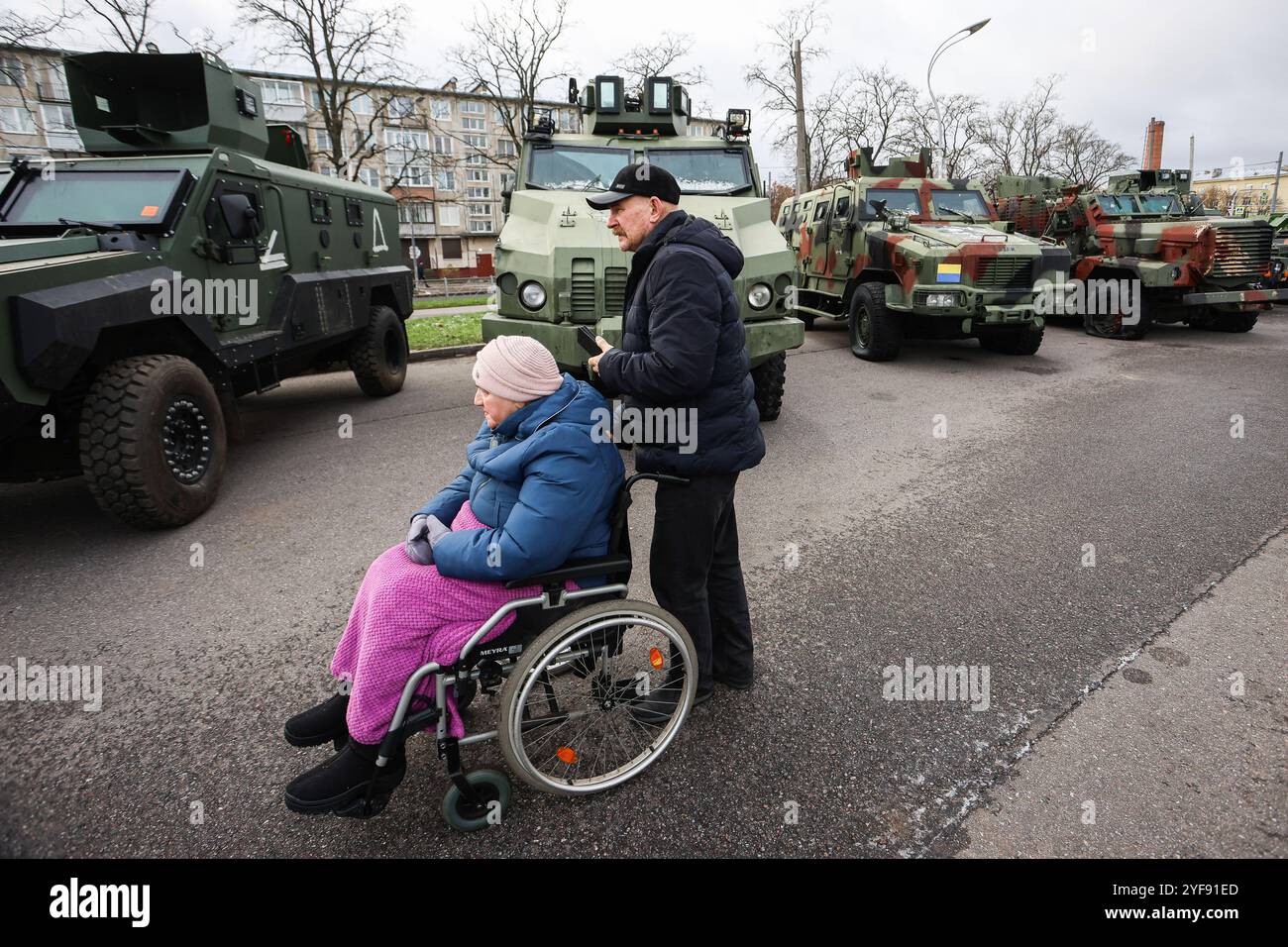 People look at military trophy equipment captured by Russian troops in ...