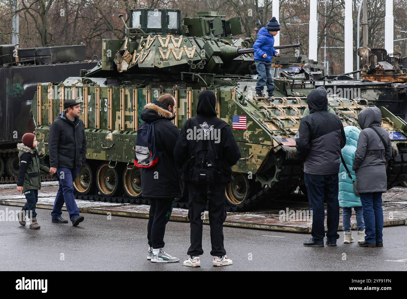 People look at a US M2 Bradley fighting vehicle captured by Russian ...