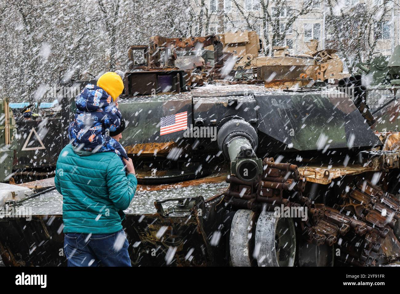 People look at a US-made M1 Abrams battle tank captured by Russian ...