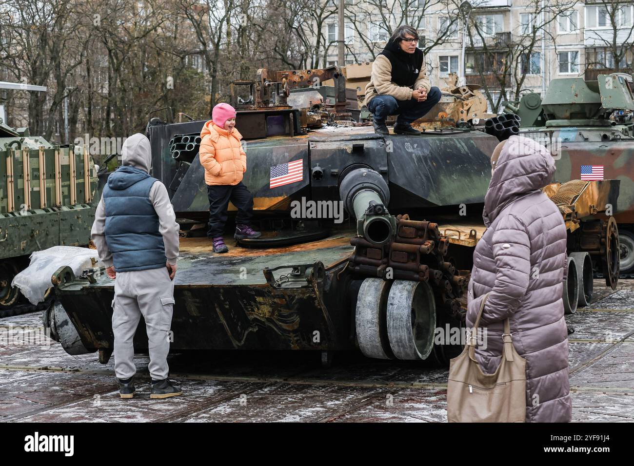 People look at a US-made M1 Abrams battle tank captured by Russian ...