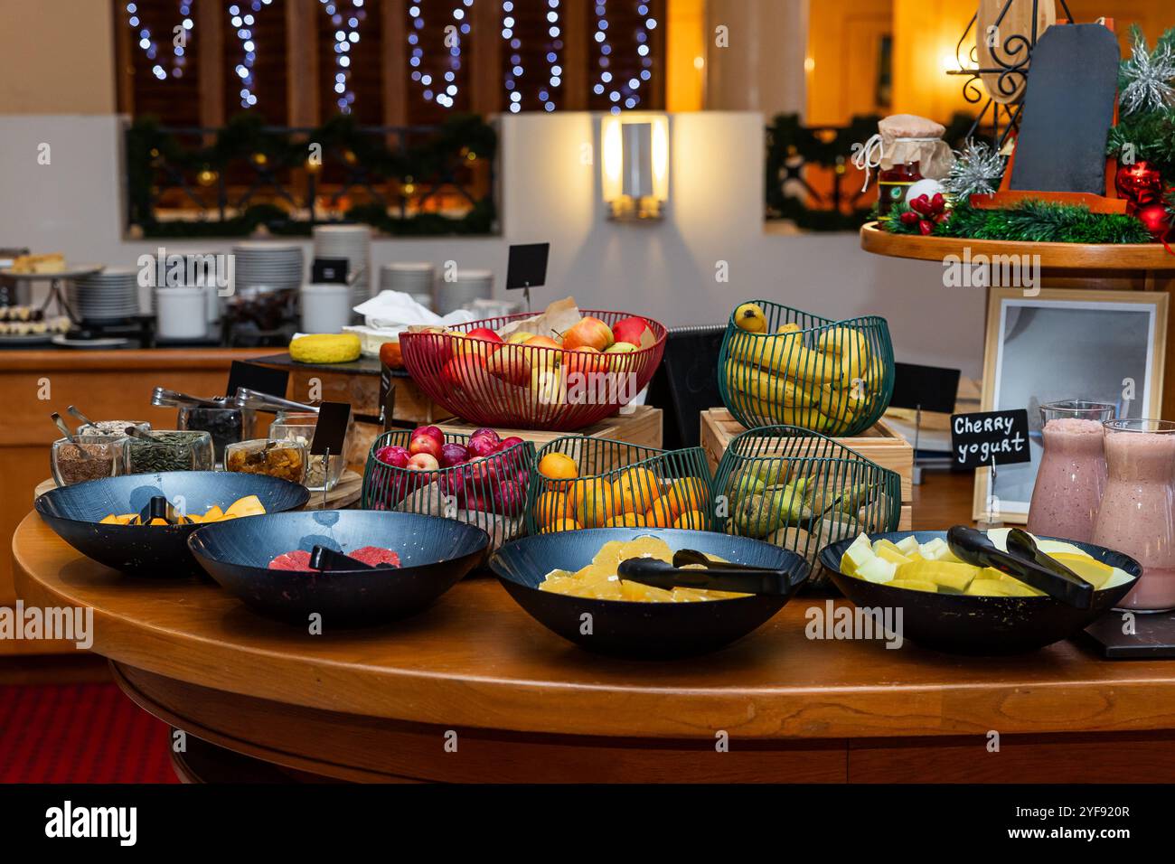 Buffet display of assorted fresh tropical fruit with oranges ...