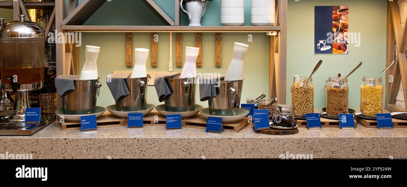 Elegant Breakfast Buffet Spread with Cereals and Milk in Modern Setting ...