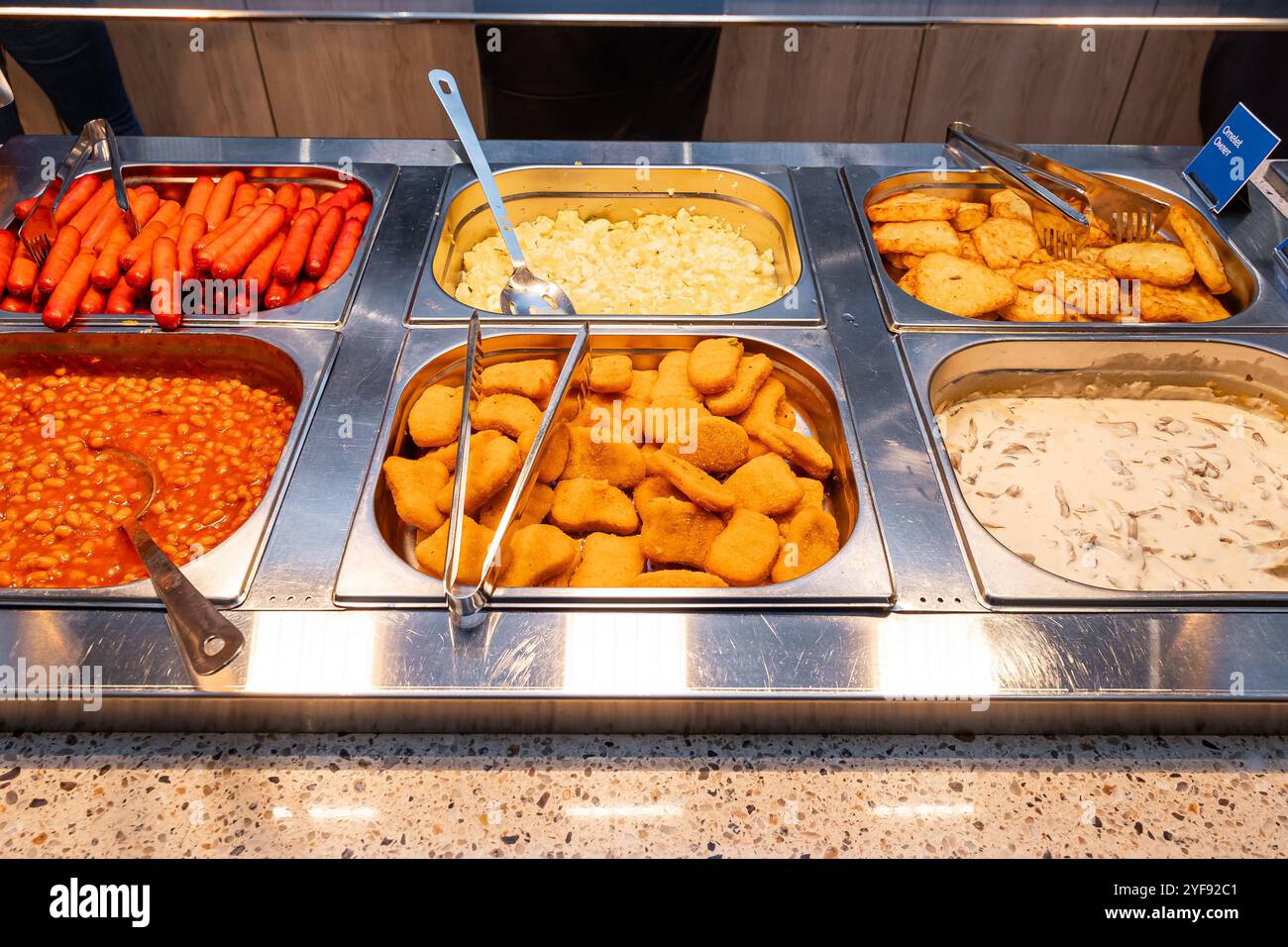 Diverse Breakfast Buffet Selection with Hot Dishes and Sides in hotel ...