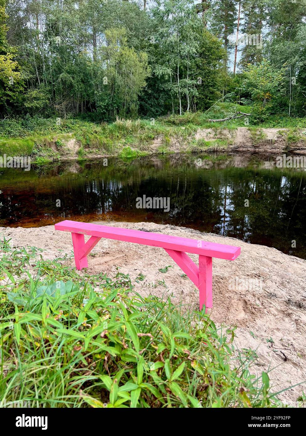 Wooden bench at a riverside hi-res stock photography and images - Alamy