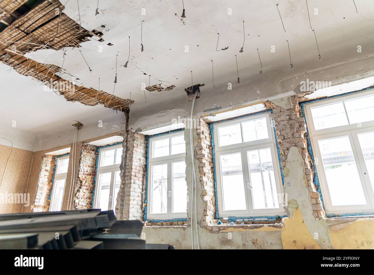 Extensive renovation in progress inside an old building with exposed ...