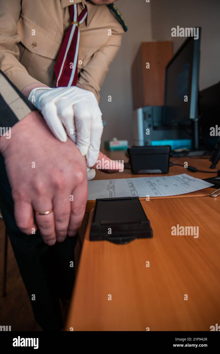 Forensic expert taking fingerprints hi-res stock photography and images ...