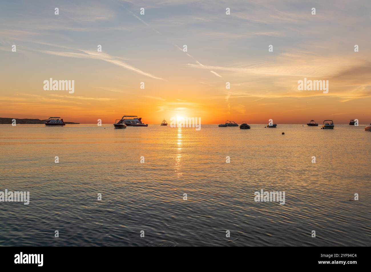 Sunrise over the sea. Panoramic seascape. Burning sky and shining ...
