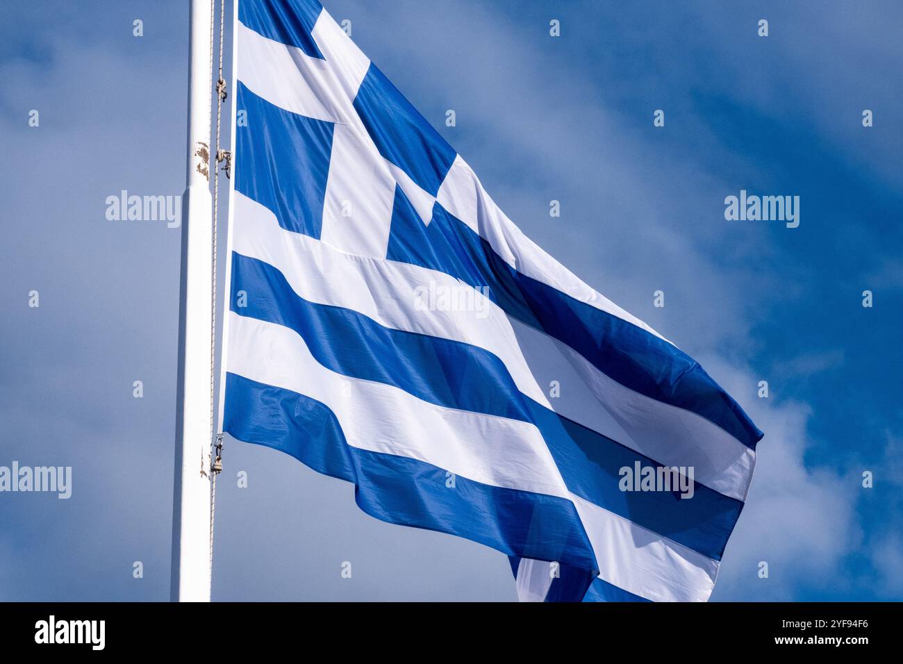 Greek flag close to the Parthenon temple on the Acropolis in Athens ...