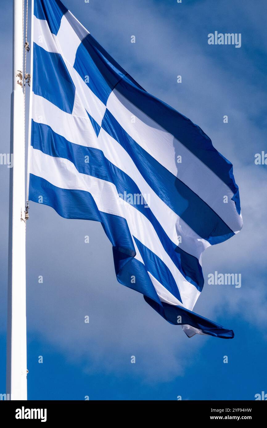 Greek flag close to the Parthenon temple on the Acropolis in Athens ...