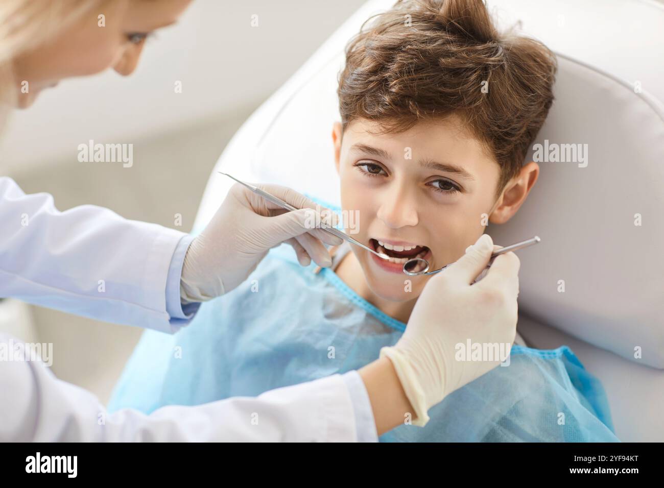 Portrait Of Happy Boy Patient During Dental Checkup With Dentist Stock Photo - Alamy