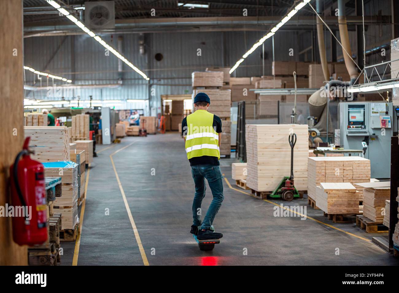 modern industrial warehouse logistics, worker using an electric ... modern industrial warehouse logistics, worker using an electric ...