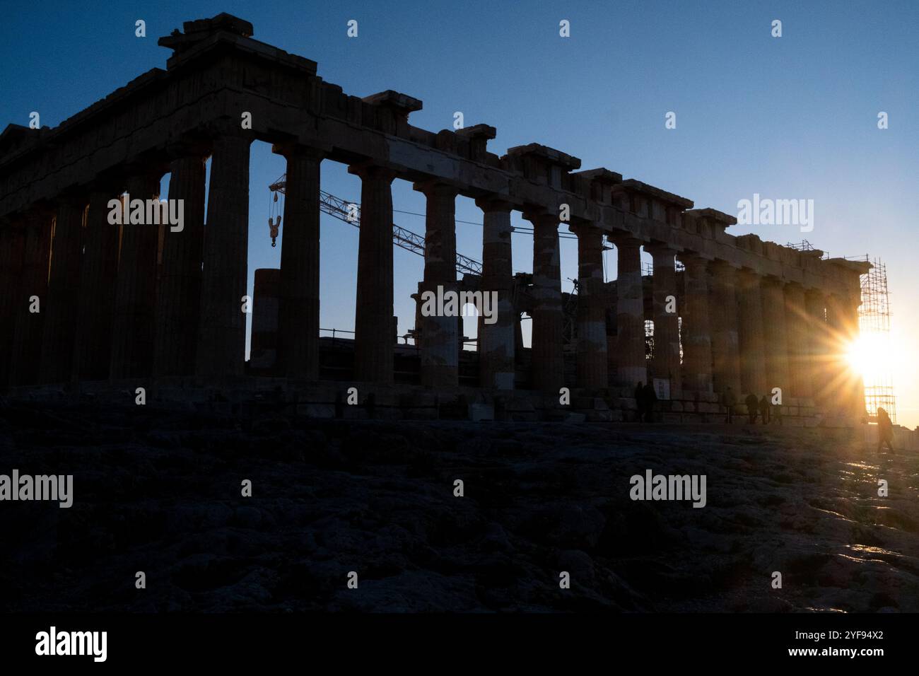 The Parthenon temple under renovation construction with crane and ...