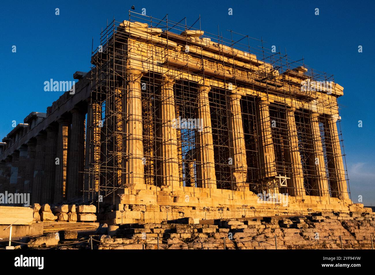 The Parthenon temple under renovation construction with crane and ...