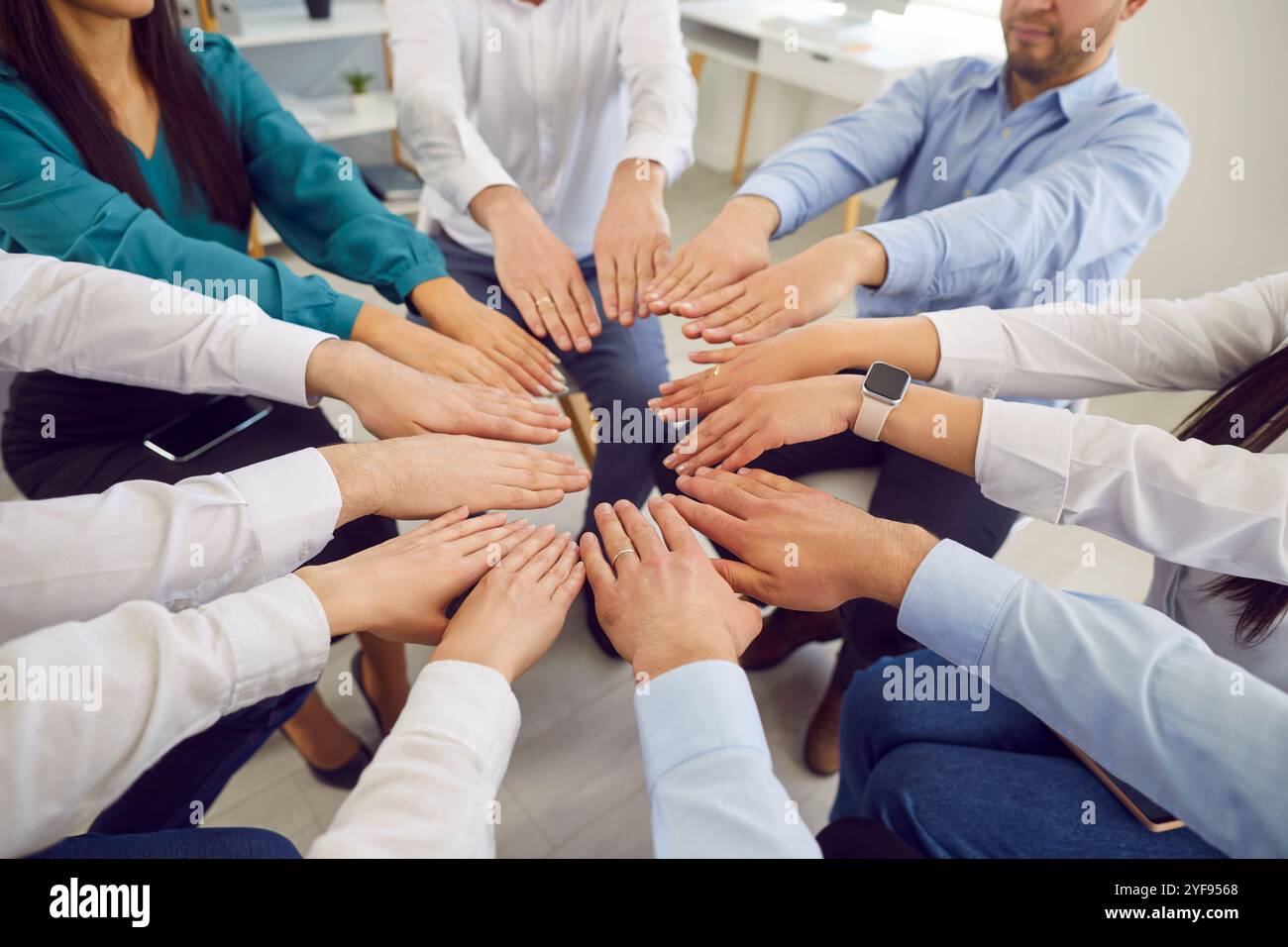 Business People Stretched Out Their Hands Connecting In A Circle Stock
