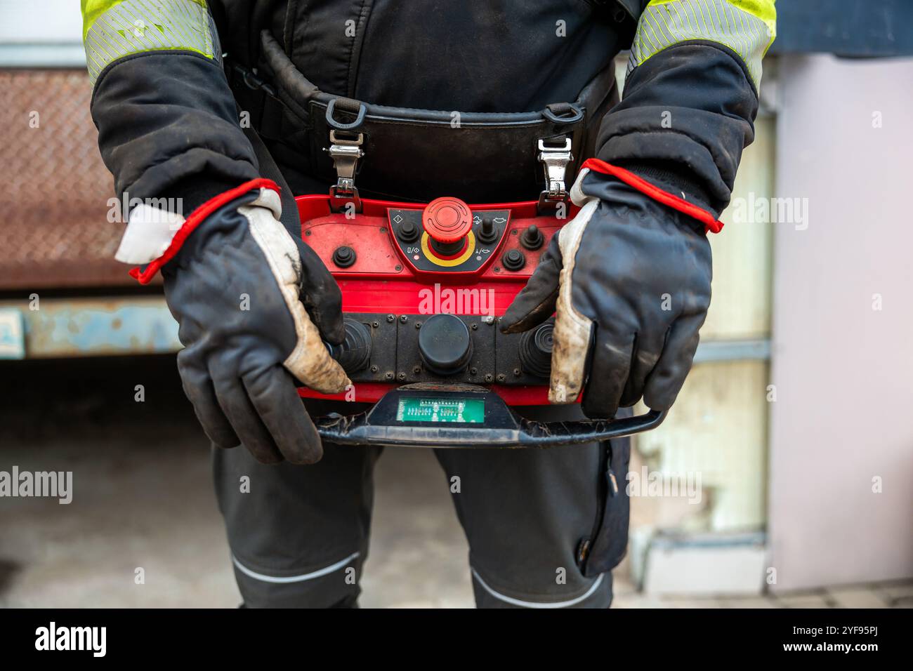 Close-up of Industrial Worker Operating a Remote Control Panel with ...