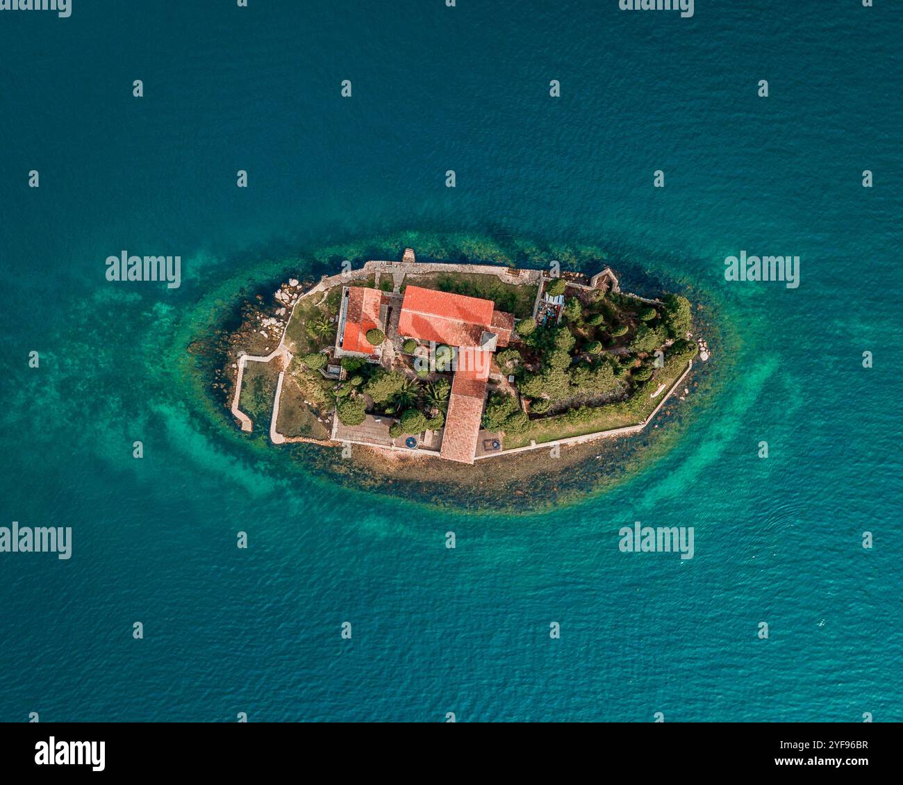 aerial view of a historic island fortress surrounded by turquoise ...