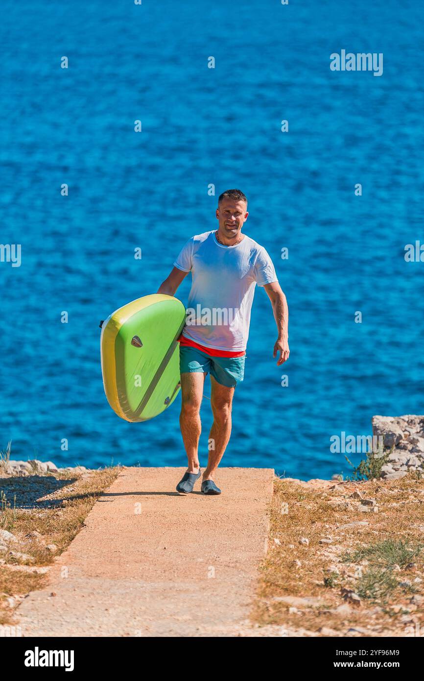 Carrying paddleboarding hi-res stock photography and images - Alamy