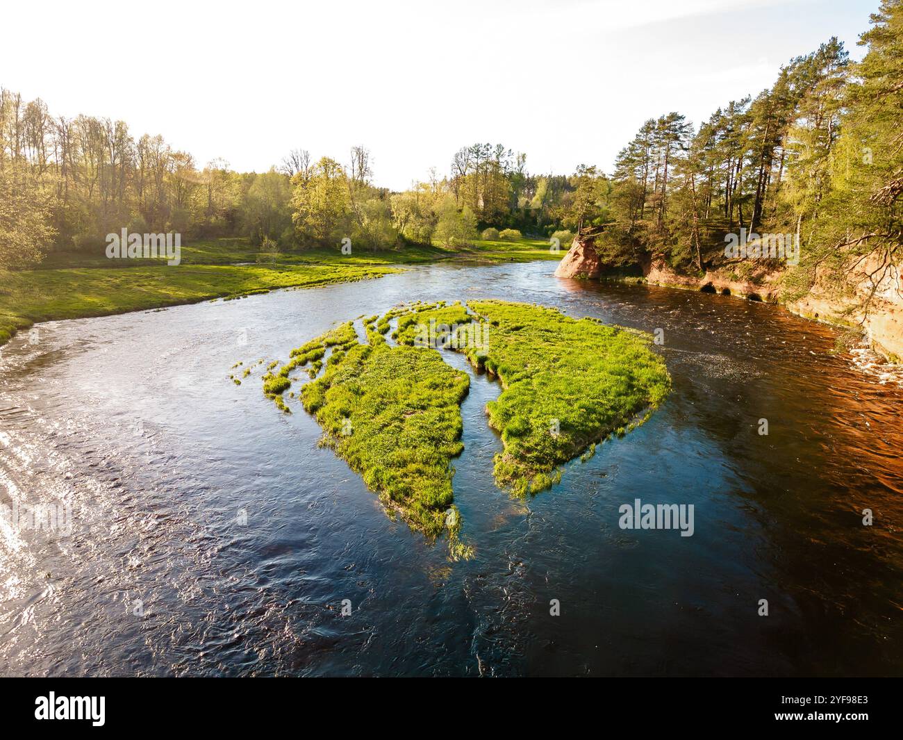 breathtaking aerial view of a river meandering through lush green ...