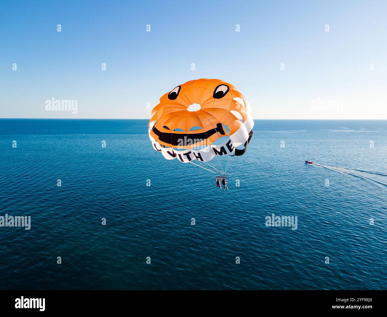 Parasailing in the beautiful blue sea at a luxury hotel resort, the ...