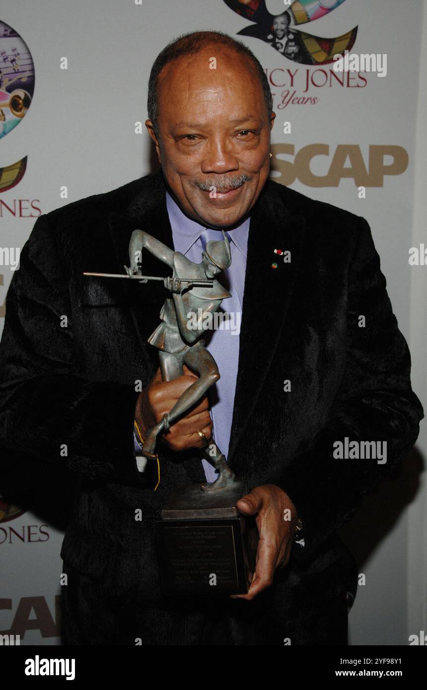 File photo - Quincy Jones poses with his award at the ASCAP Pied Piper ...