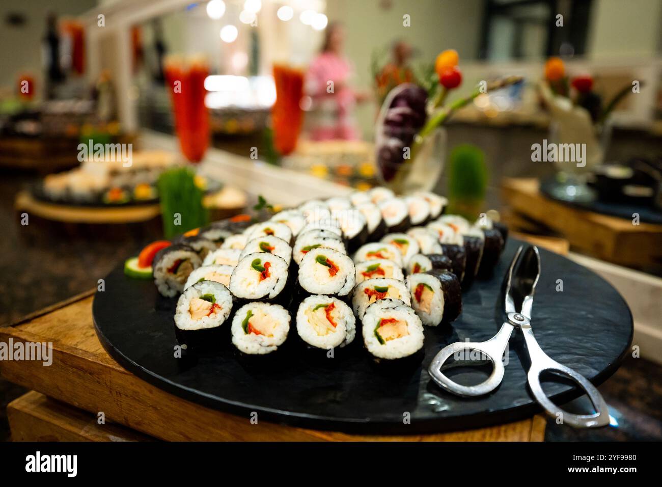 A tray of beautifully presented sushi in a luxury hotel setting. The ...