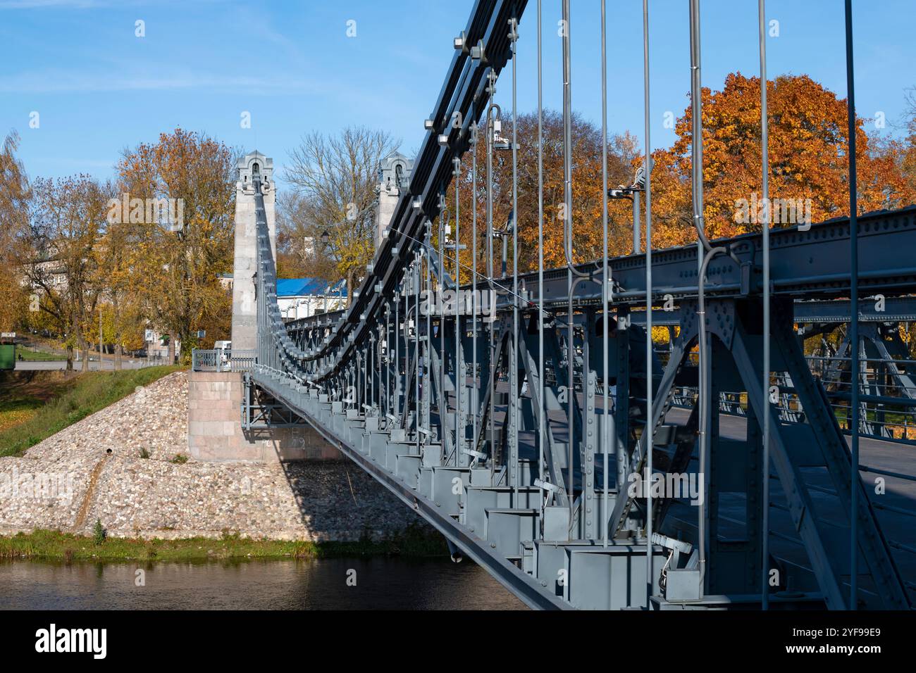 Ancient chain bridge in golden autumn. Ostrov town. Pskov region ...