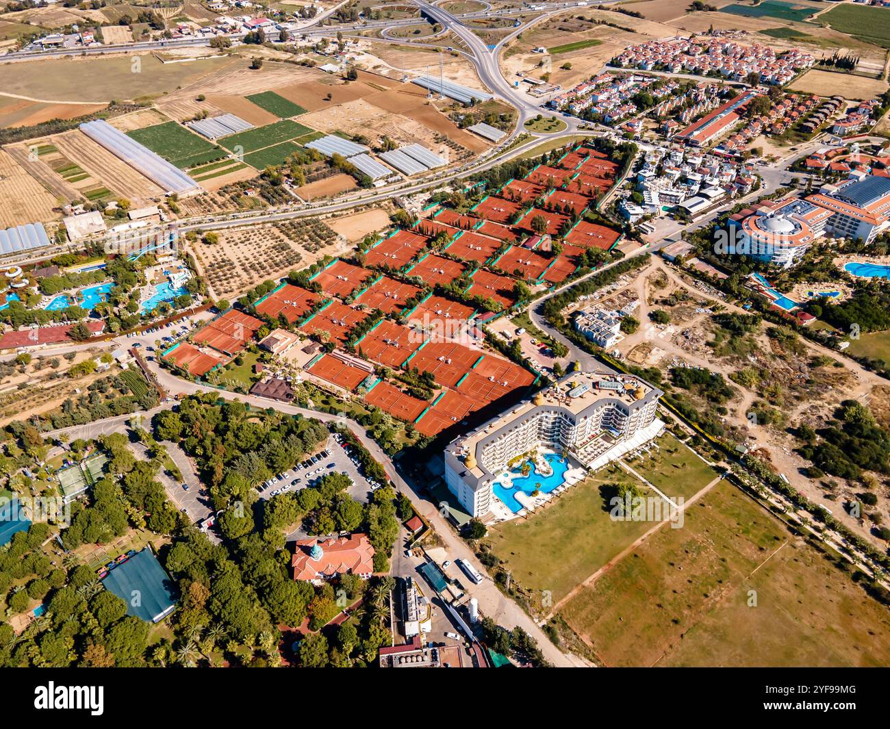 aerial view of multiple tennis courts, providing a glimpse of the ...