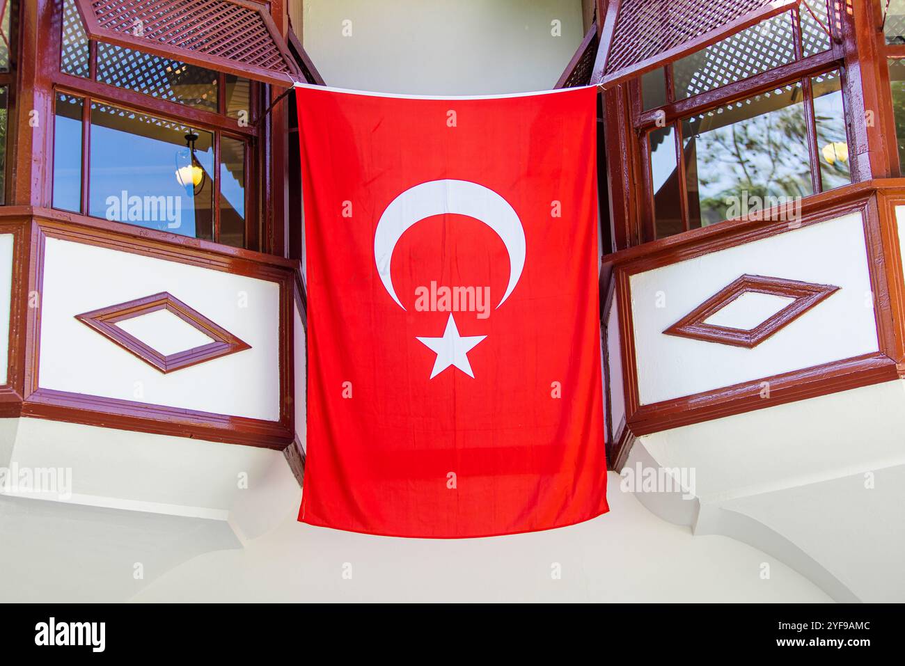 large Turkish flag displayed prominently on the wall of a house ...
