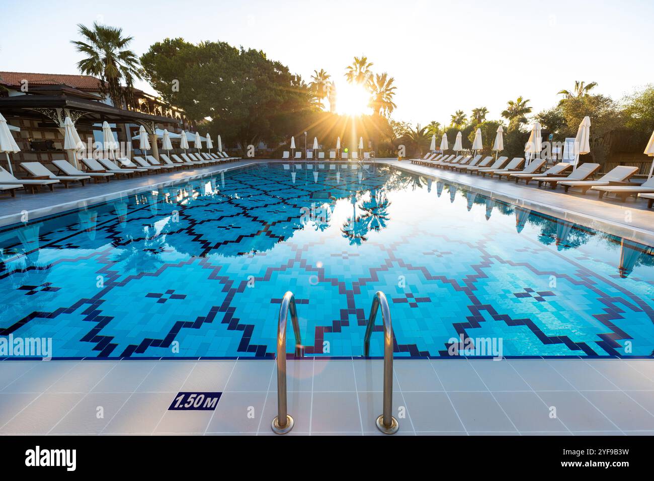 relaxing summer scene at a luxurious resort with empty deck chairs and ...